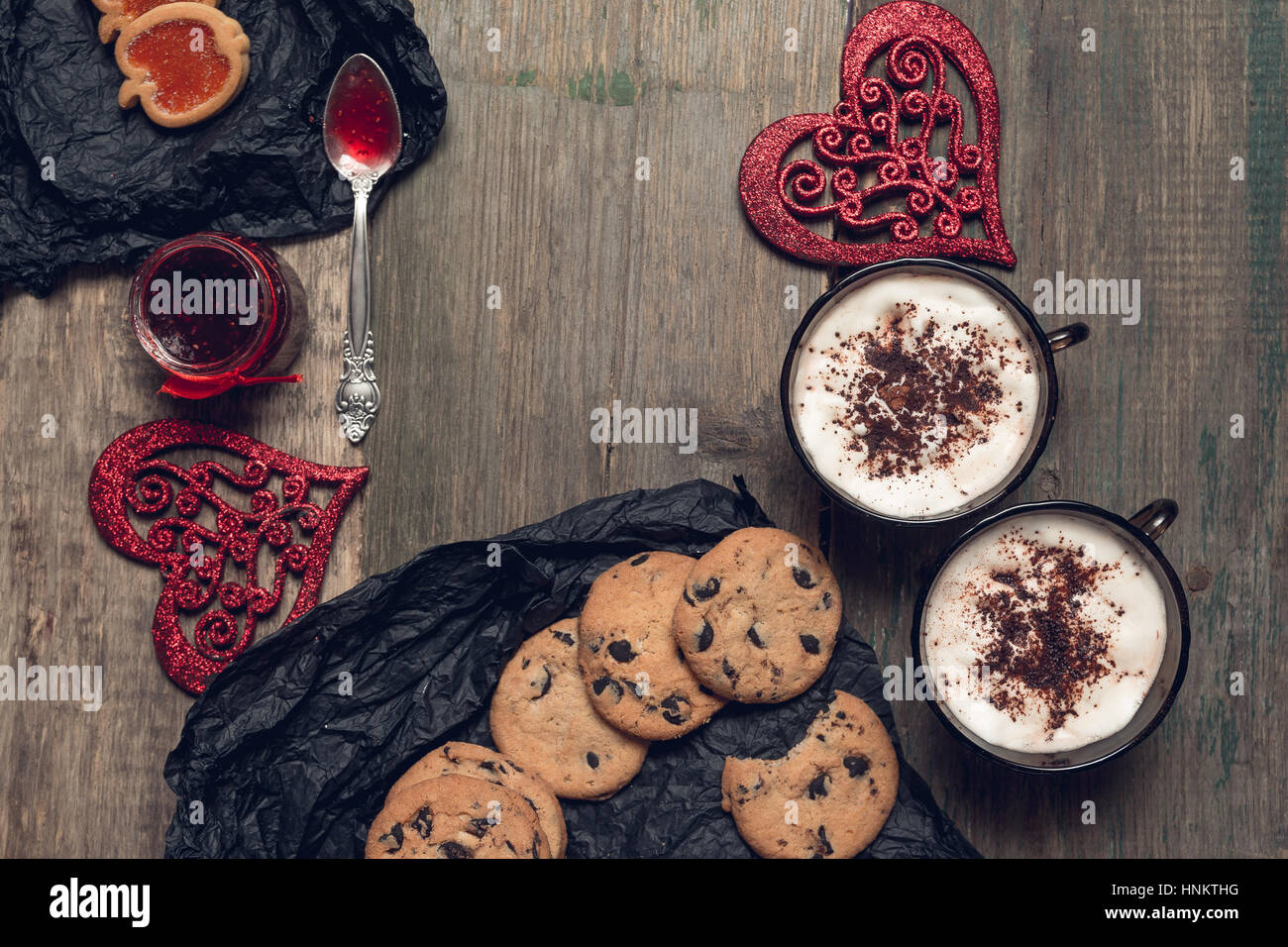 cookies and biscuits on black table background. Afternoon break time ...