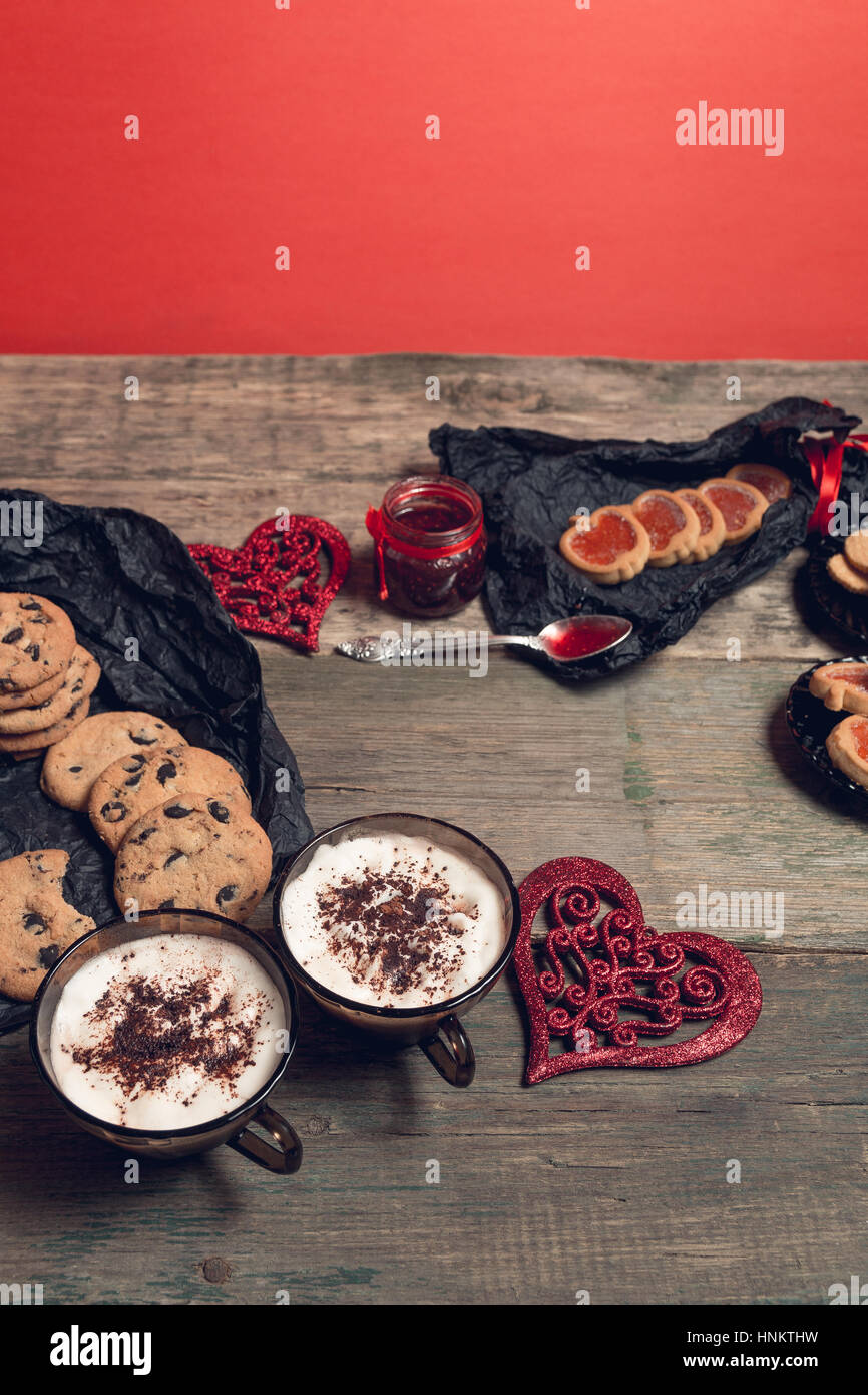 cookies and biscuits on black table background. Afternoon break time ...