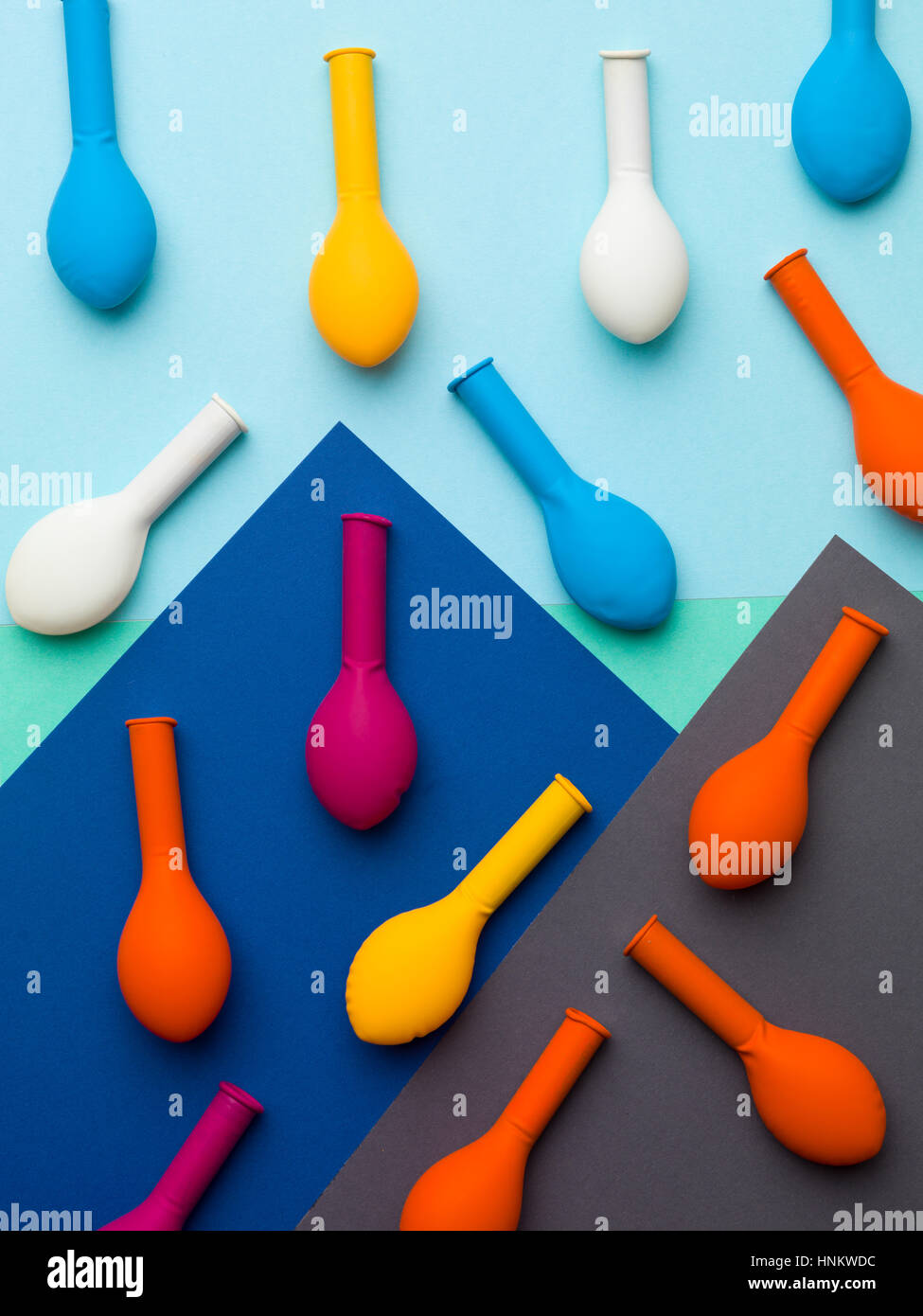 arranged pattern of colorful deflated balloons on color shapes Stock ...
