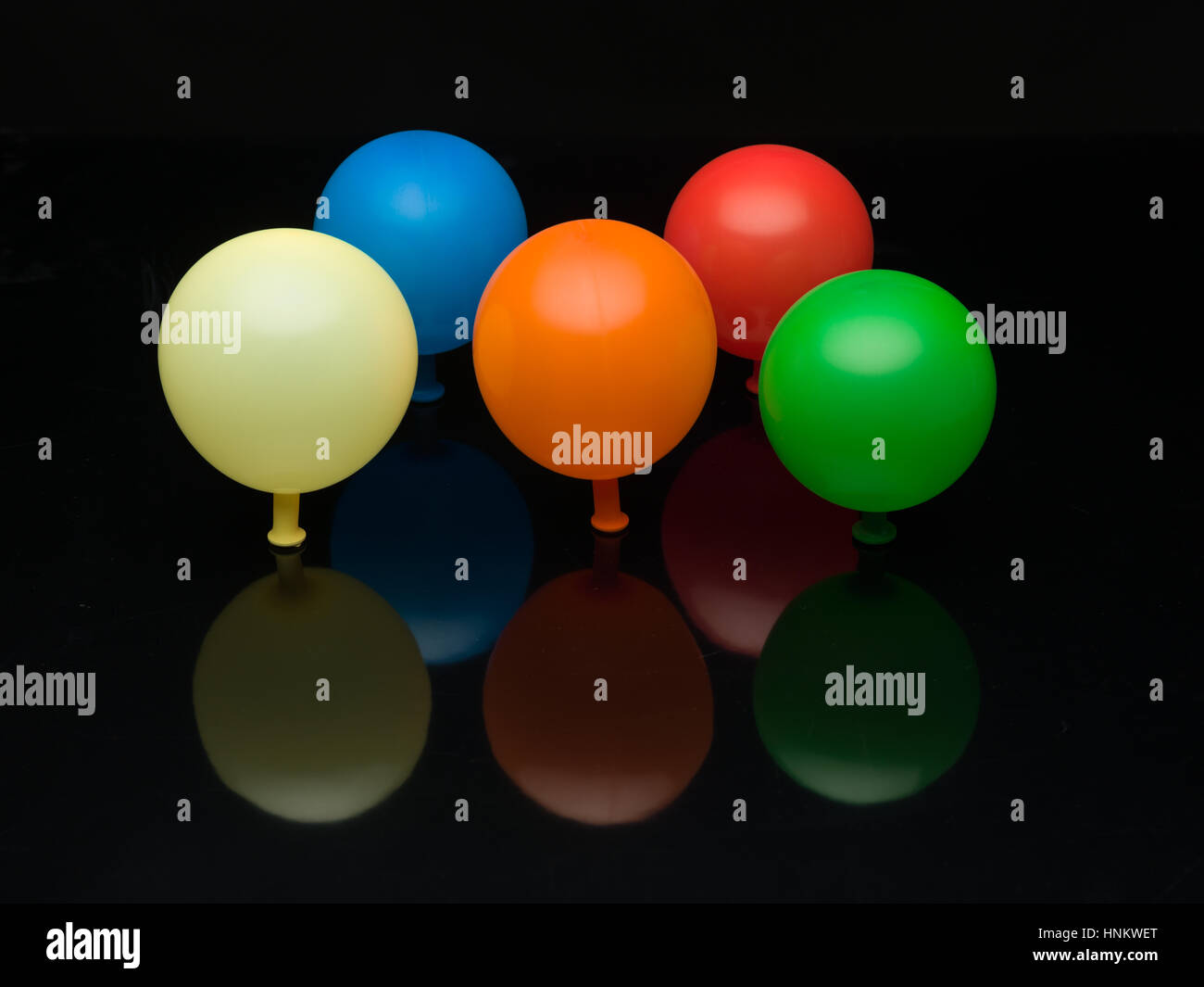 group of colorful balloons on background with reflection Stock Photo ...