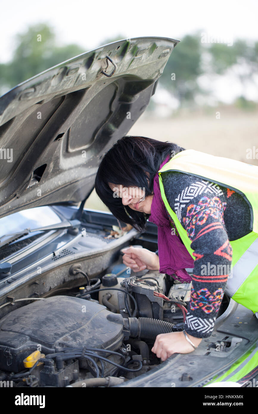 Woman car broke down on the empty road, Selective focus and small depth ...