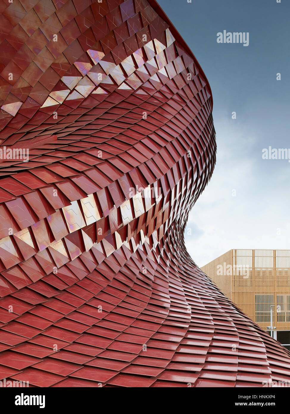 Red, scale-like exterior facade of Vanke Pavilion. Milan Expo 2015 ...