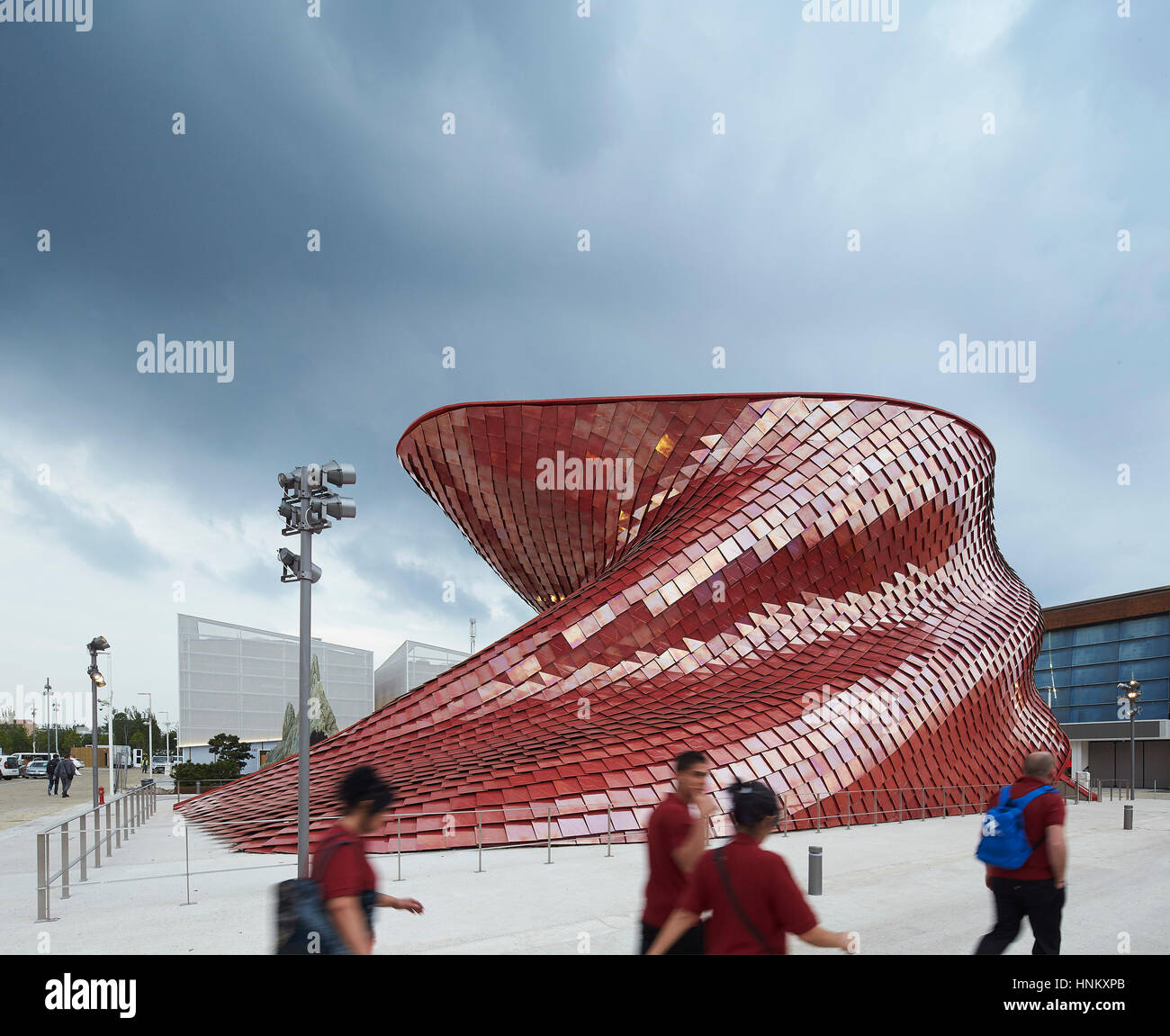 Visitors in motion in front of pavilion facade. Milan Expo 2015, Vanke ...