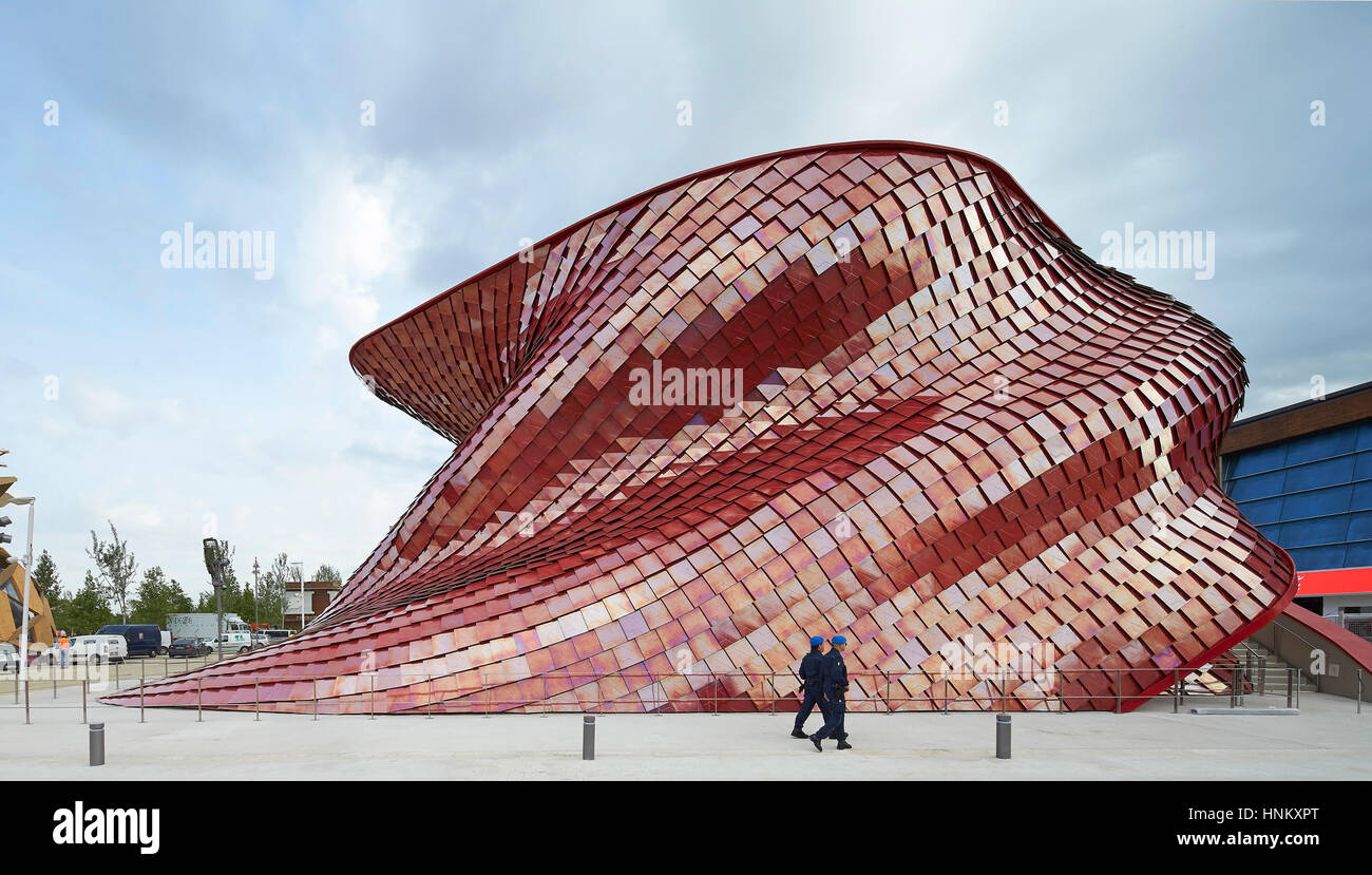 Dragon-skin facade and visitors passing by. Milan Expo 2015, Vanke ...