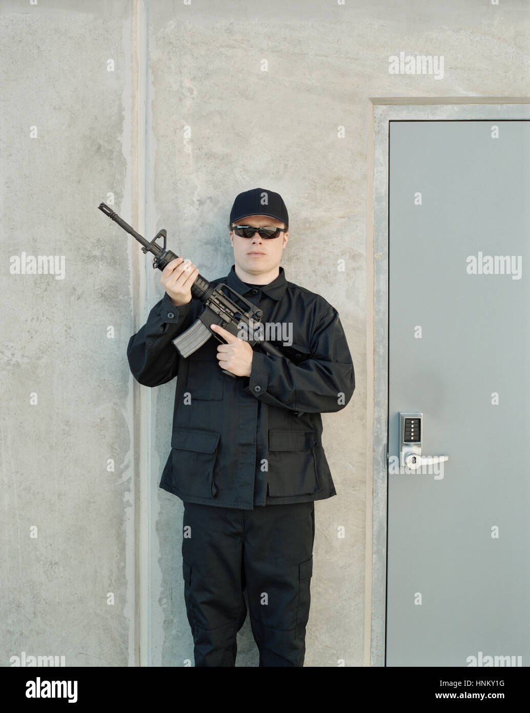 Man wearing special forces uniform and holding high powered semi ...