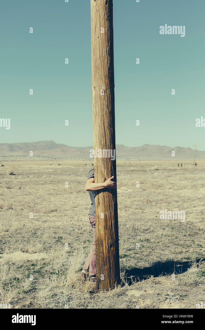 Hugging pole hi-res stock photography and images - Alamy