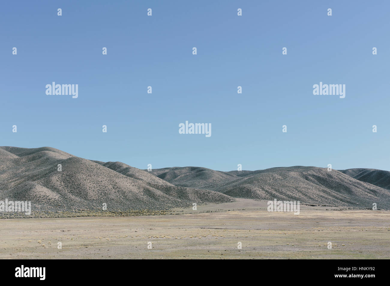 A flat plain and view towards a range of mountains Stock Photo - Alamy