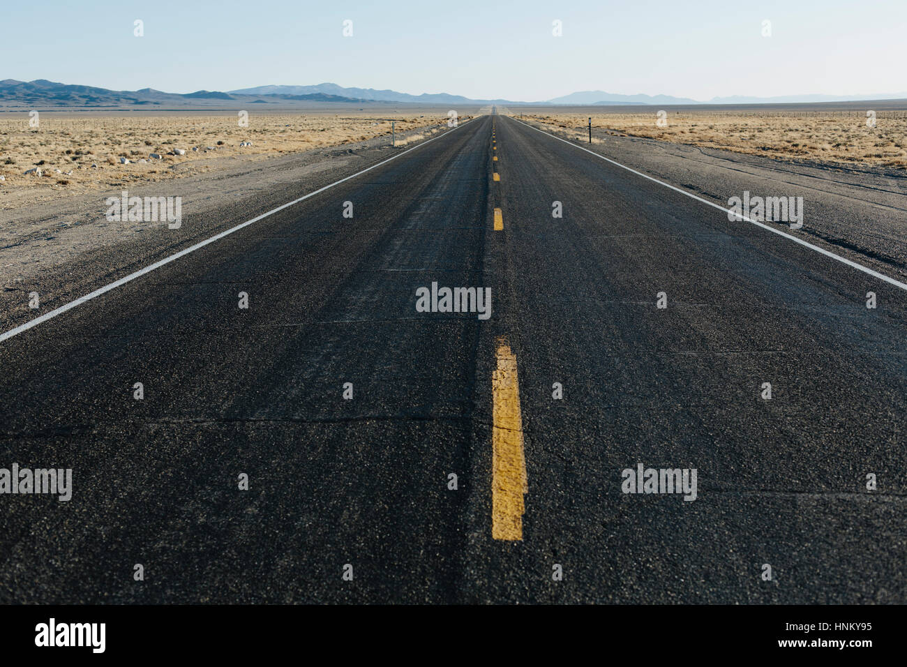 Remote rural two lane road reaching to the horizon Stock Photo - Alamy