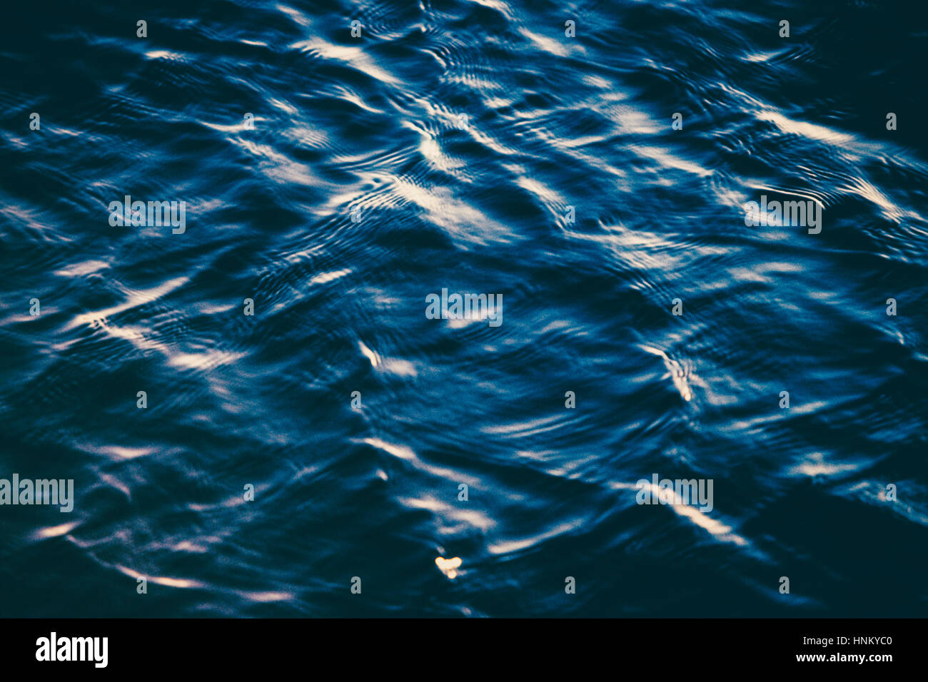 The ocean surface, deep blue water, ripples, sunlight and shade Stock ...