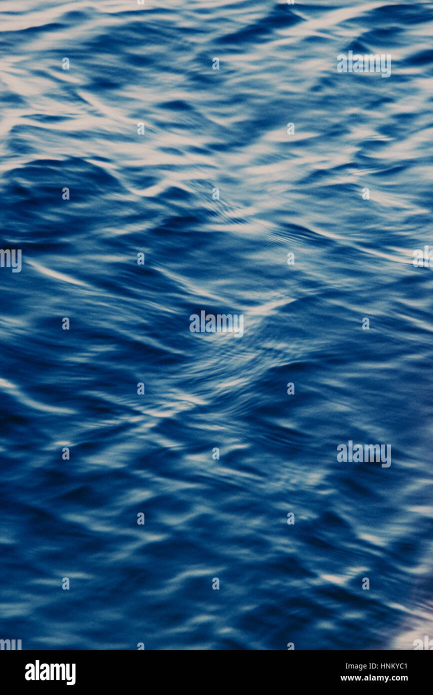 The ocean surface, deep blue water, ripples, sunlight and shade Stock ...