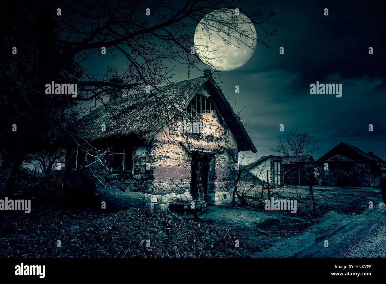 Spooky ghost house at night Stock Photo - Alamy