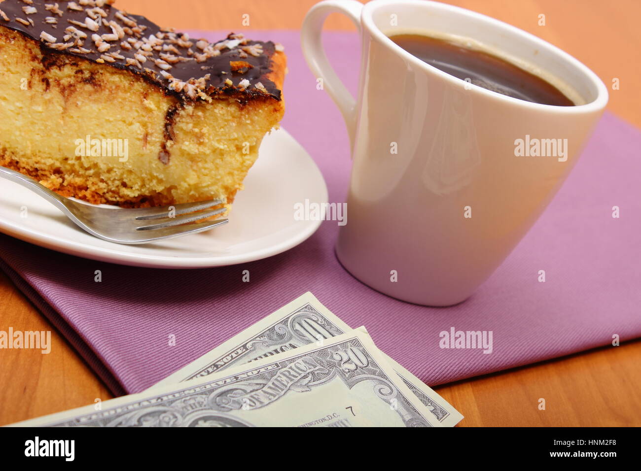 Paying for food in the cafe or restaurant, cheesecake and coffee ...