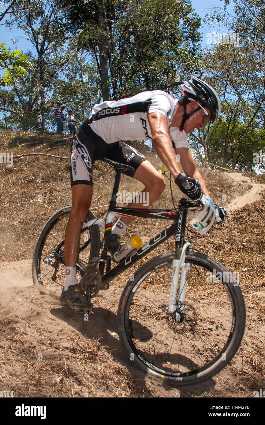 Cyclists descending by steep mountain Stock Photo - Alamy
