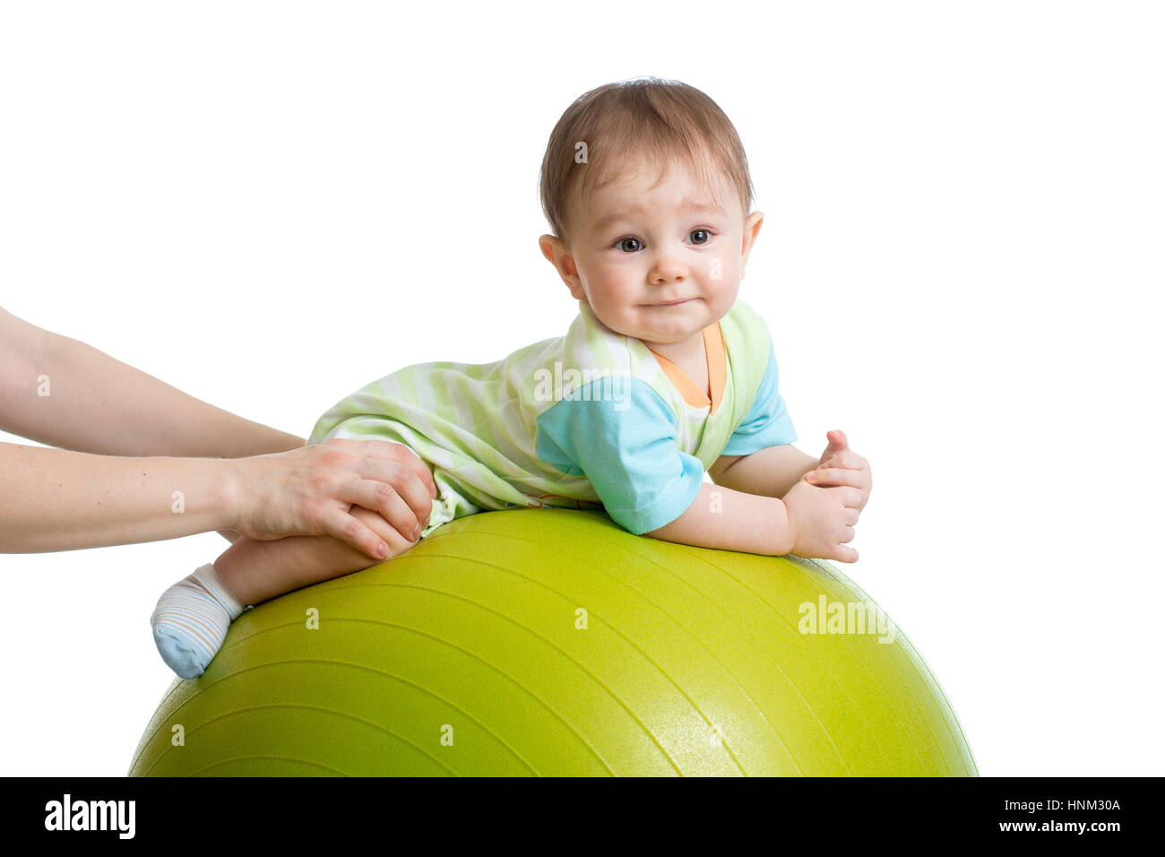 Portrait of smiling baby on fitness ball. Exercise and massage, baby ...