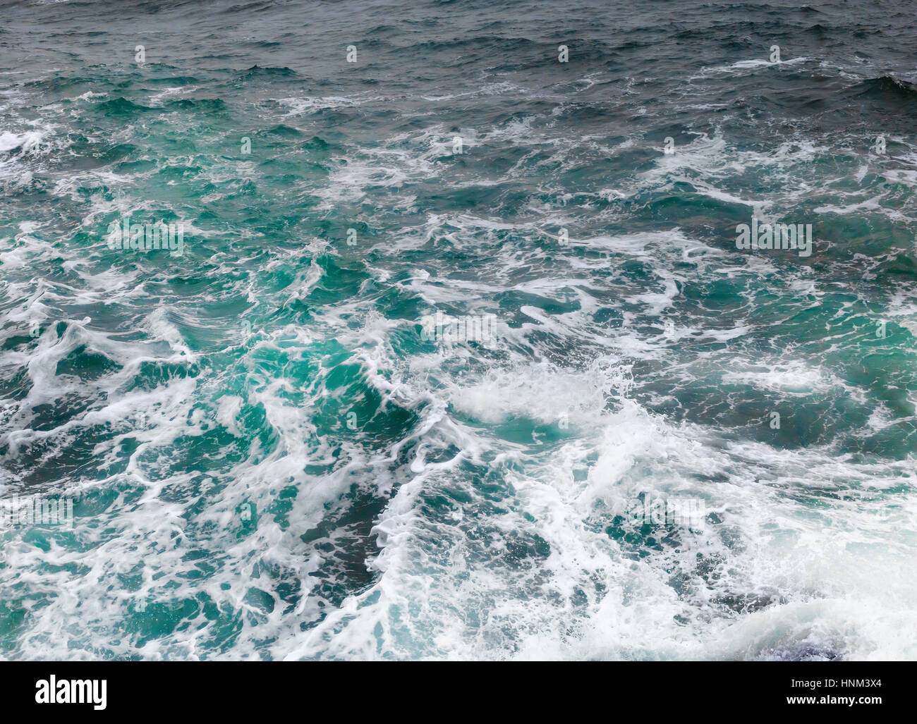 Sea waves with foam. Top view. Ocean on a cloudy windy day. Turquoise ...