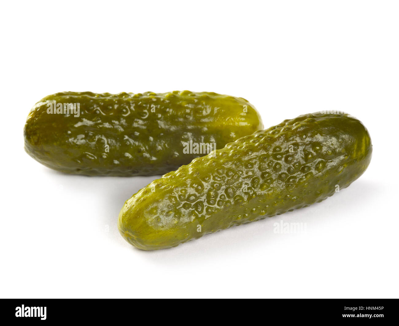 Photo of two isolated pickles on white background Stock Photo - Alamy