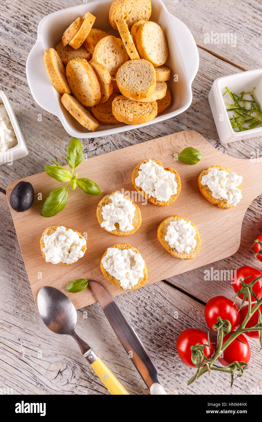 Simple sandwiches with cottage cheese on bruschetta Stock Photo - Alamy