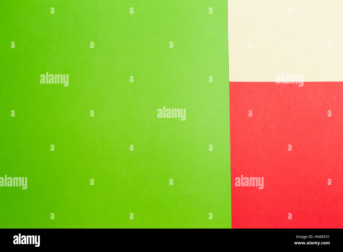 Greenery, red and yellow colored paper background Stock Photo - Alamy
