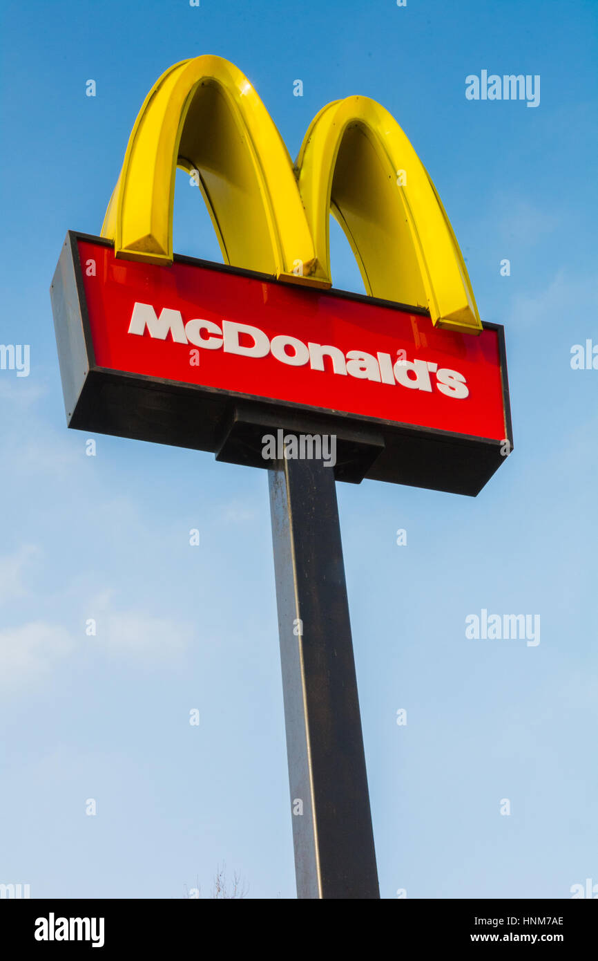 McDonald's Logo arches sign against a blue sky Stock Photo - Alamy