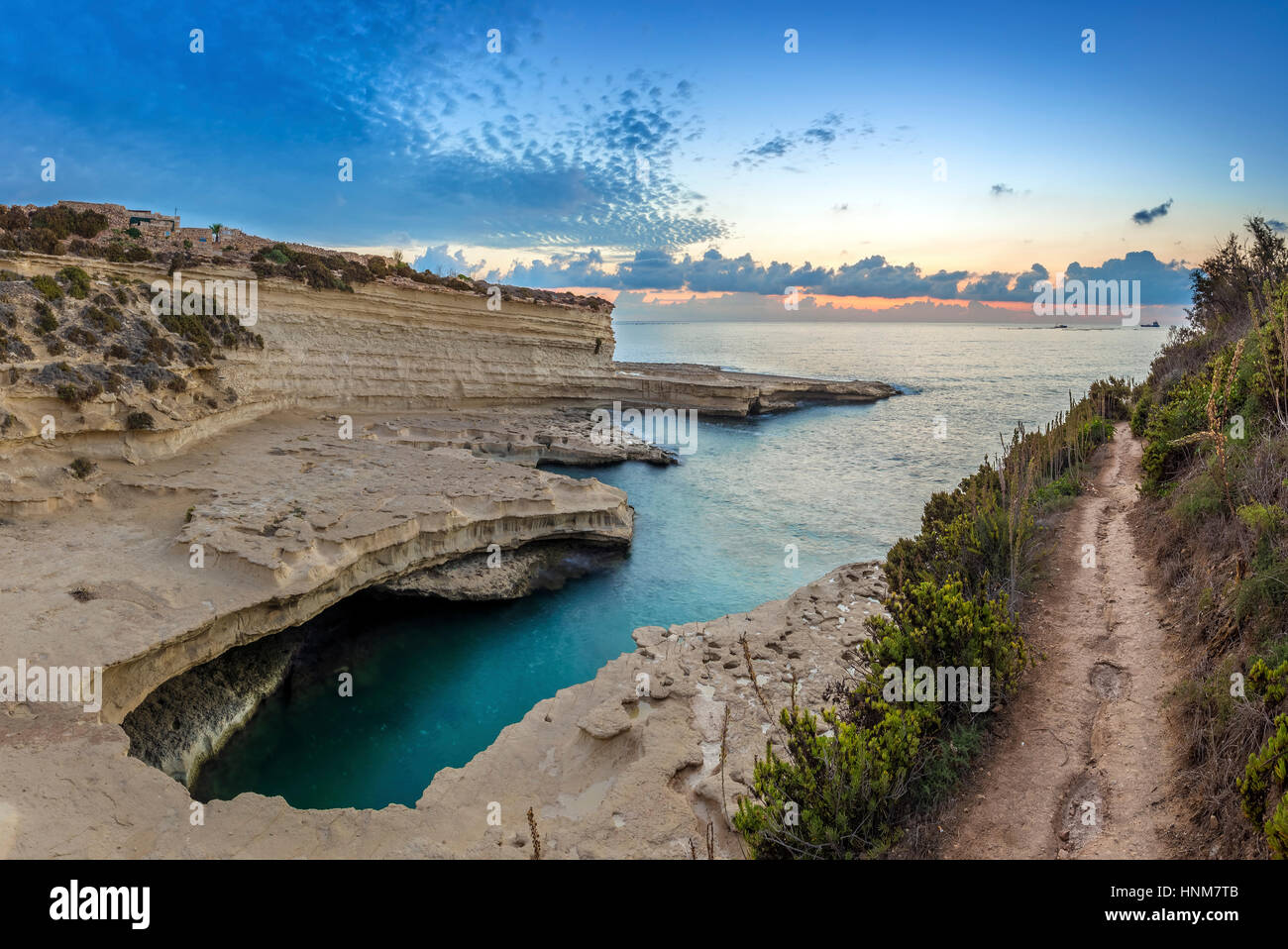 Malta - Panoramic view of the sunrise at St.Peter's pool, Delimara ...