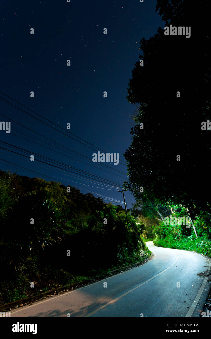 Rural road at night with starry sky in the background Stock Photo - Alamy