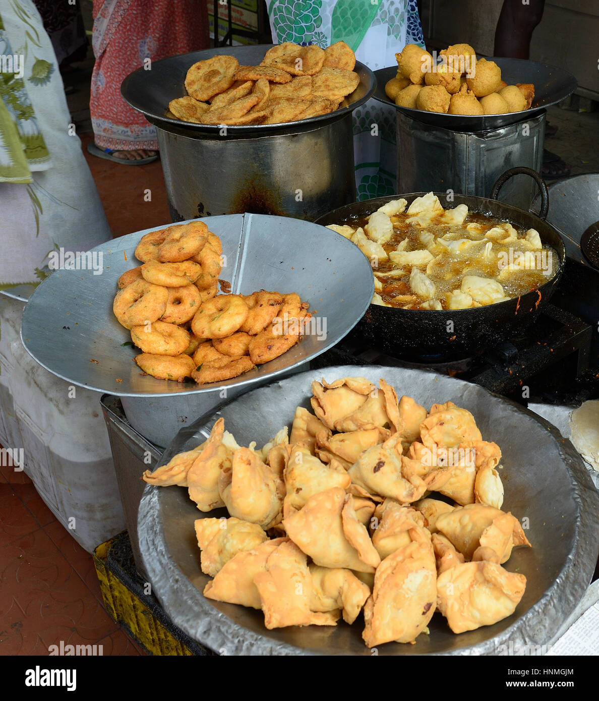 Plain Indian snacks, samosas, fried in deep oil sold in the street ...