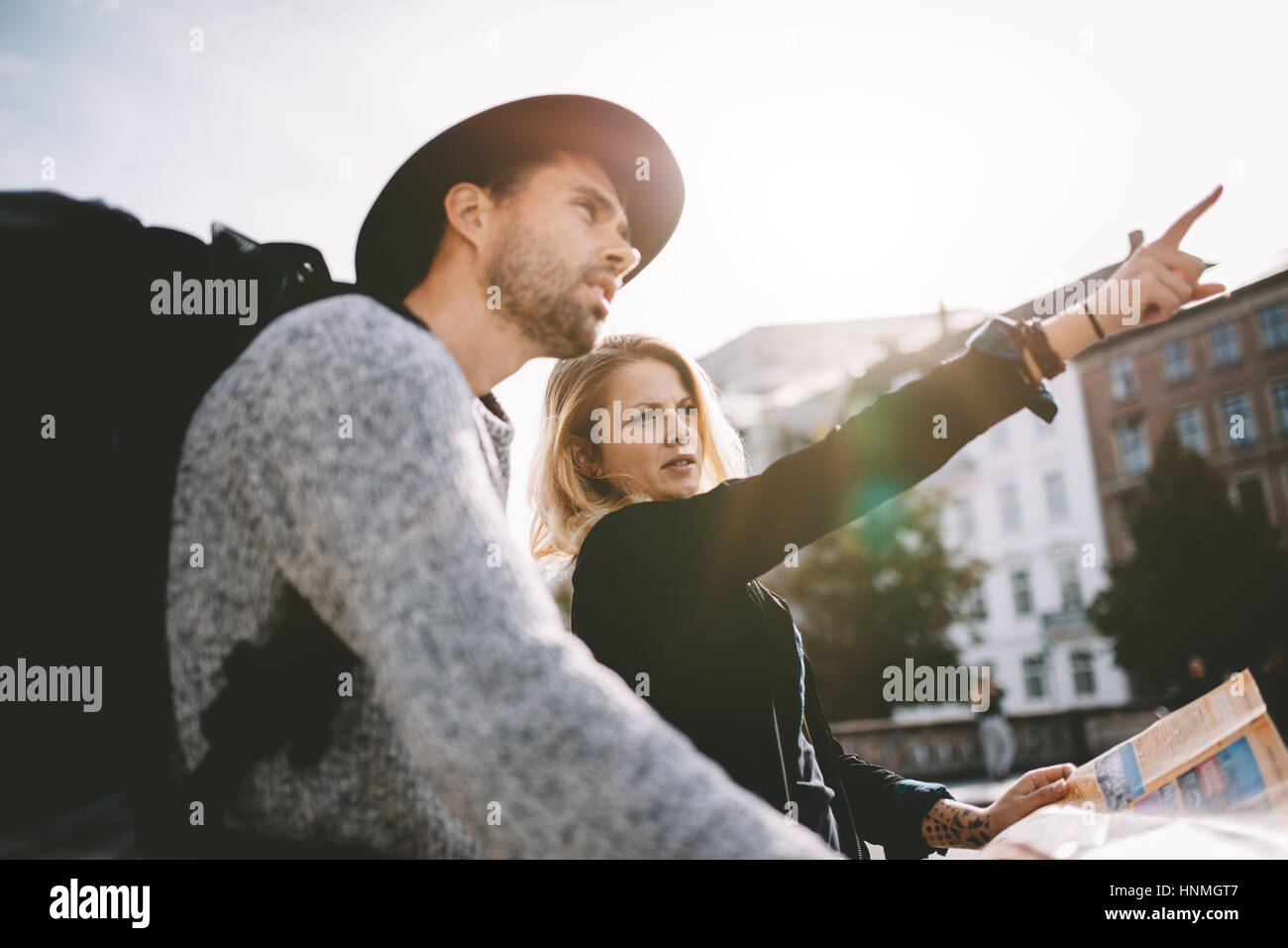 Tourists holding map hi-res stock photography and images - Alamy