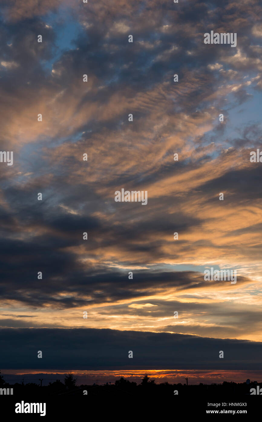 Cloudy sunset sky Stock Photo - Alamy