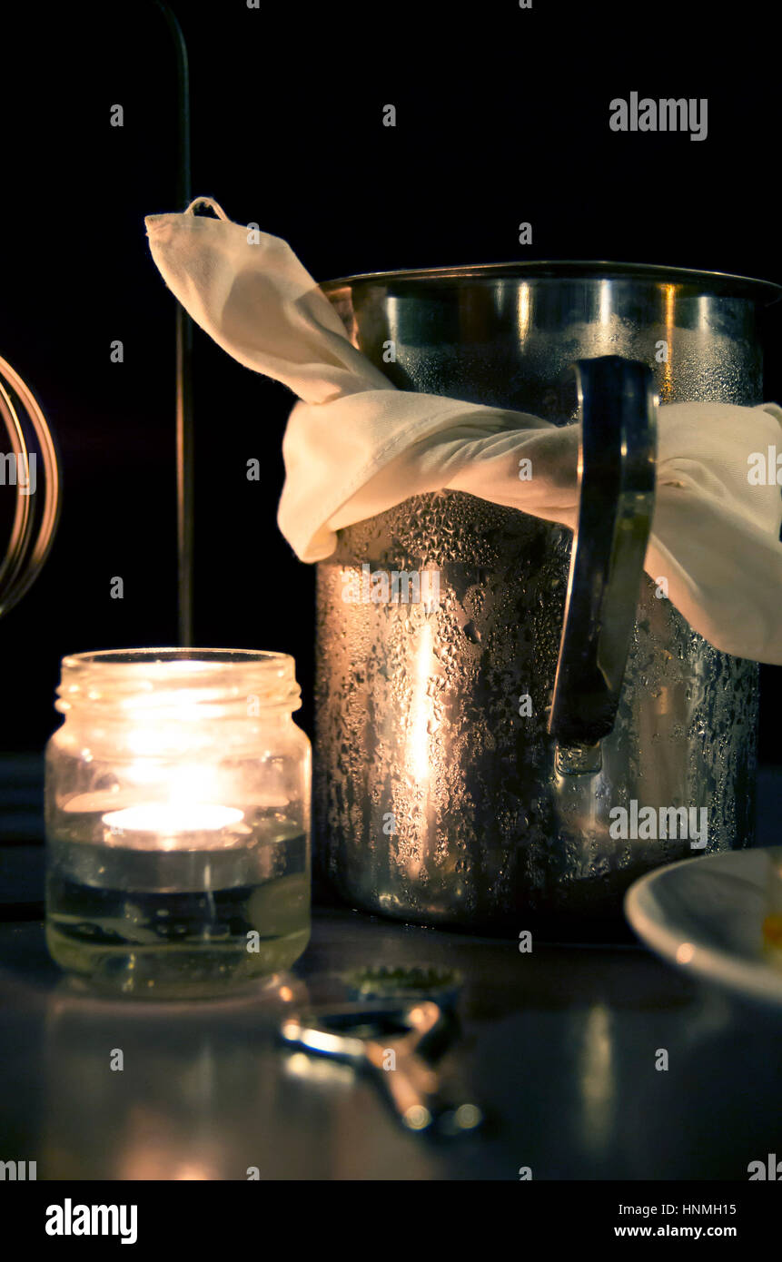 Candle light on table.with ice bucket Stock Photo - Alamy