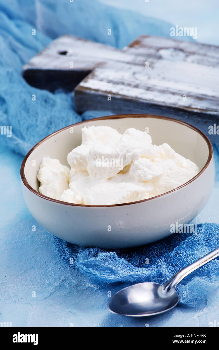ricotta in bowl and on a table Stock Photo - Alamy