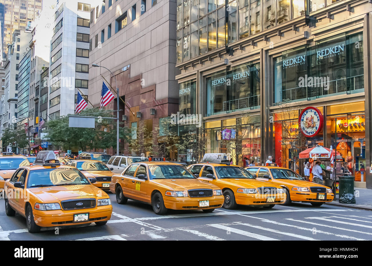 New York yellow cabs waiting for a zebra crossing at 3rd avenue Stock ...