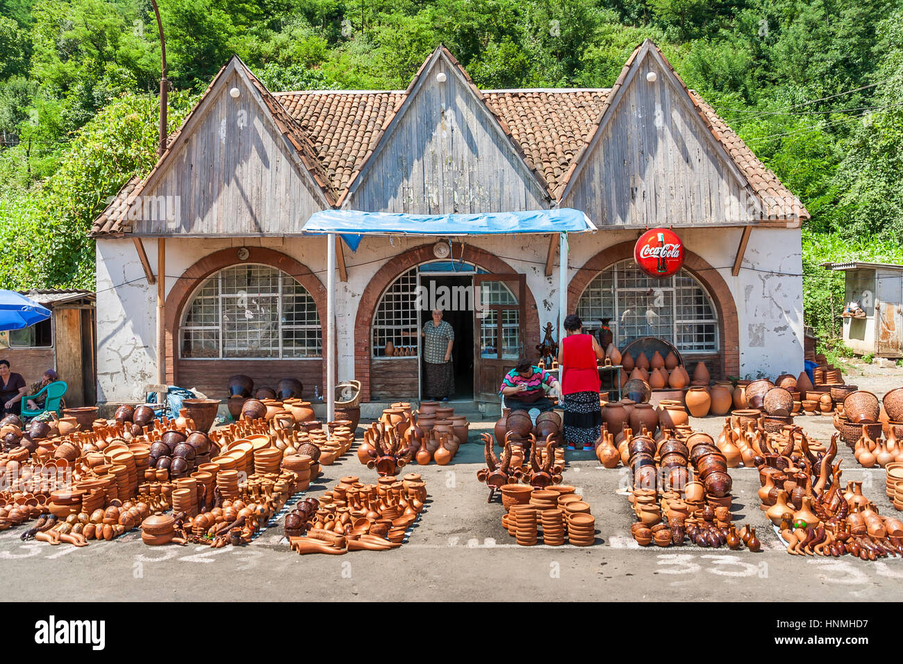 Traditional Georgian pottery displayed at a shop along a road in ...