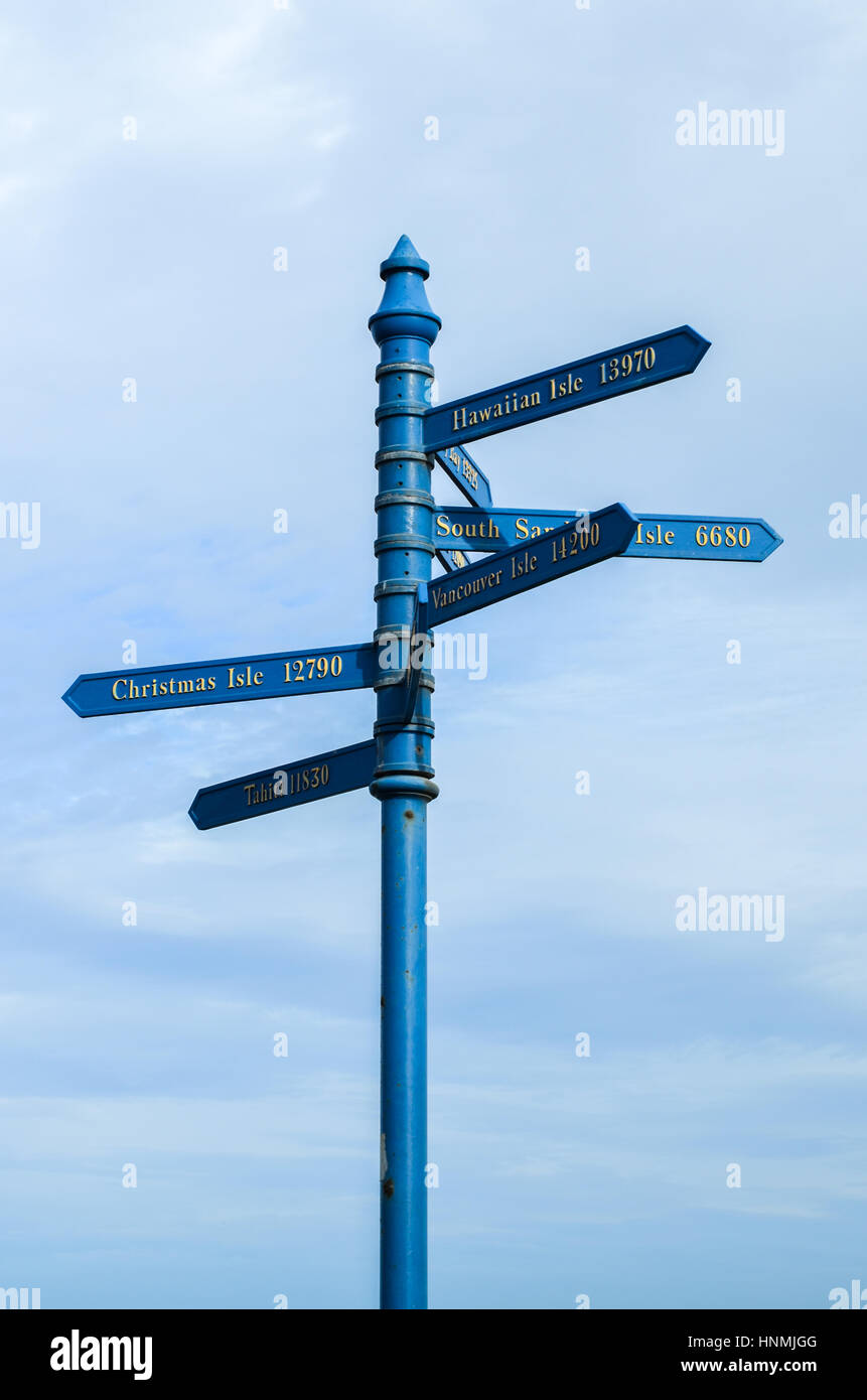 Distance marker sign post in Whitby, North Yorkshire Stock Photo - Alamy