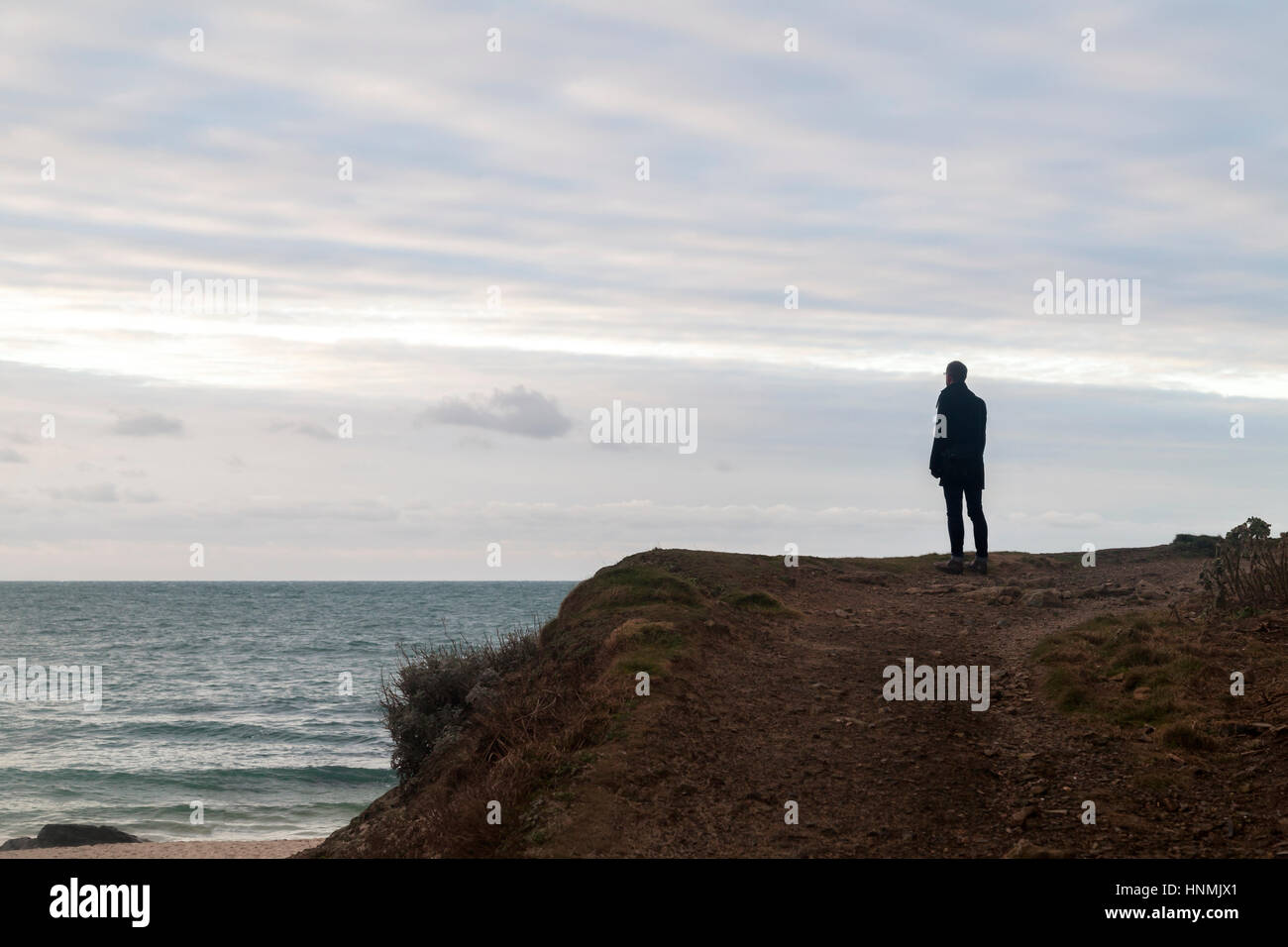 A man looks over the horizon in St Ives Stock Photo - Alamy