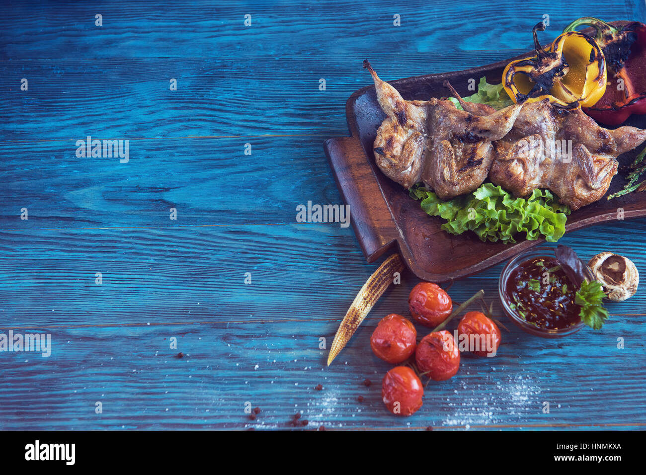 Grilled quail meat Stock Photo - Alamy