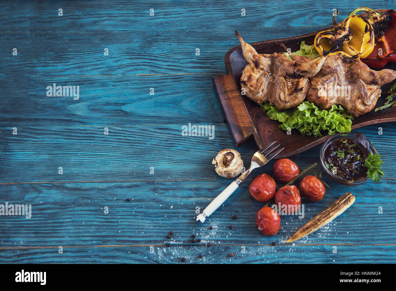 Grilled quail meat Stock Photo - Alamy