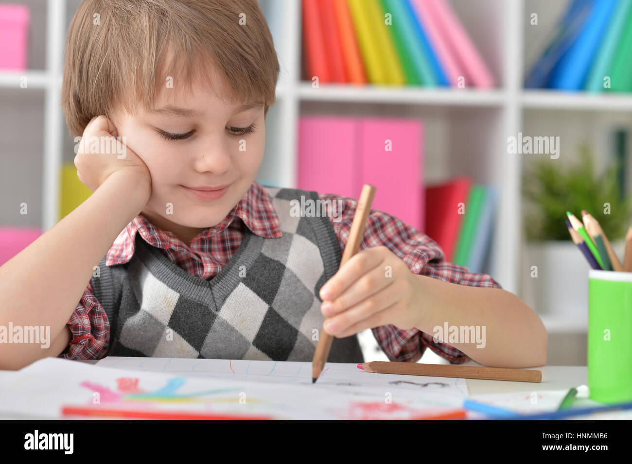 Little boy drawing with colorful pencils Stock Photo - Alamy