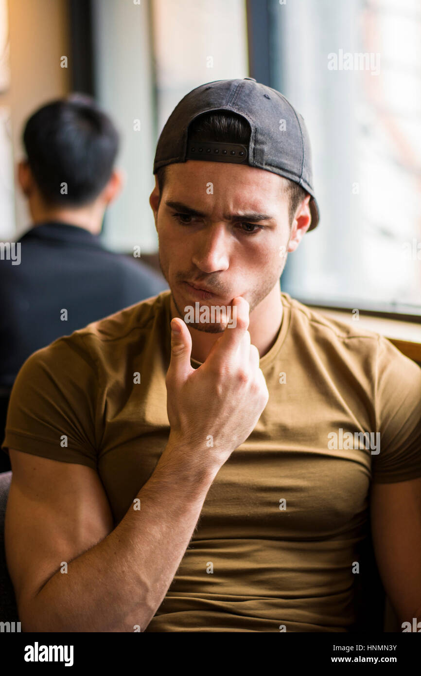 Scratching cheek hi-res stock photography and images - Alamy