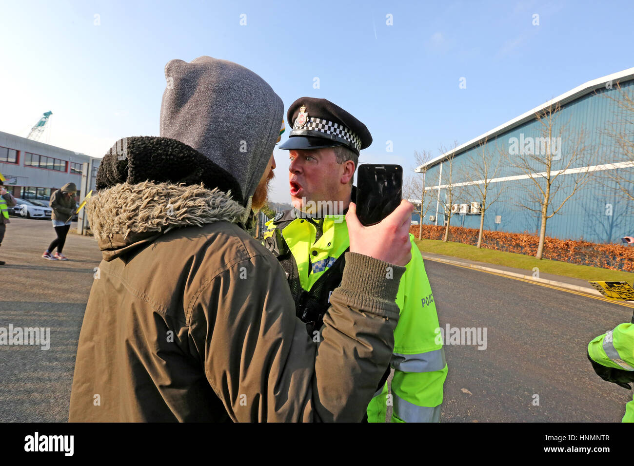 Bolton, UK. 14th Feb, 2017. A police officer shouting at a campaigner ...
