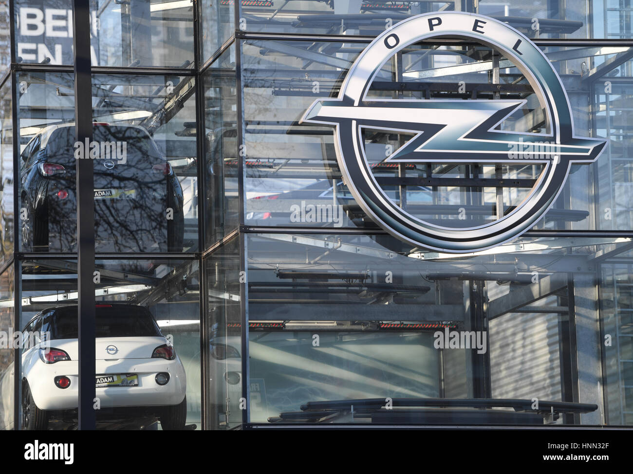 Models of the Opel compact car Adam are seen in a glass tower outside ...