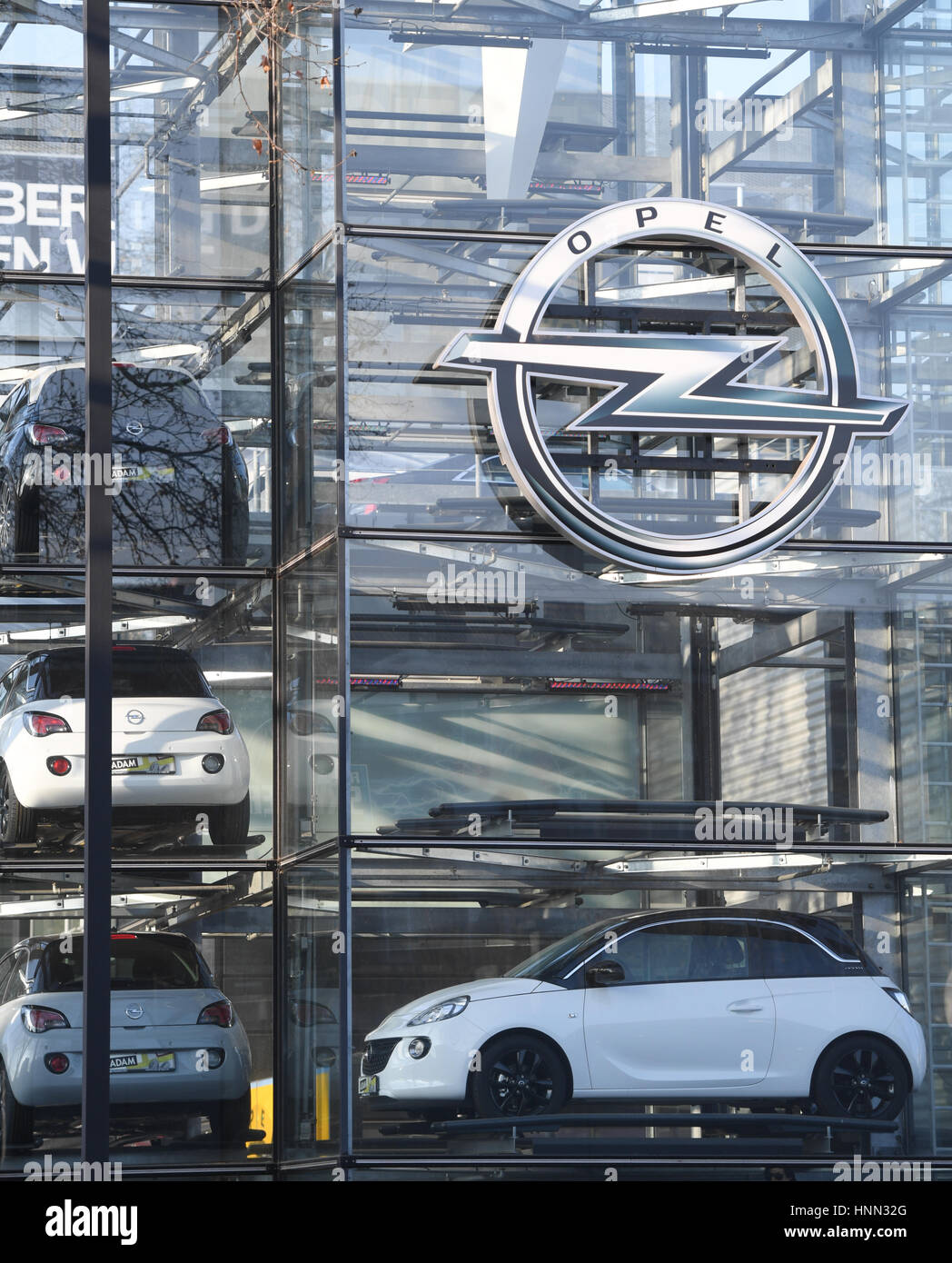 Models of the Opel compact car Adam are seen in a glass tower outside ...
