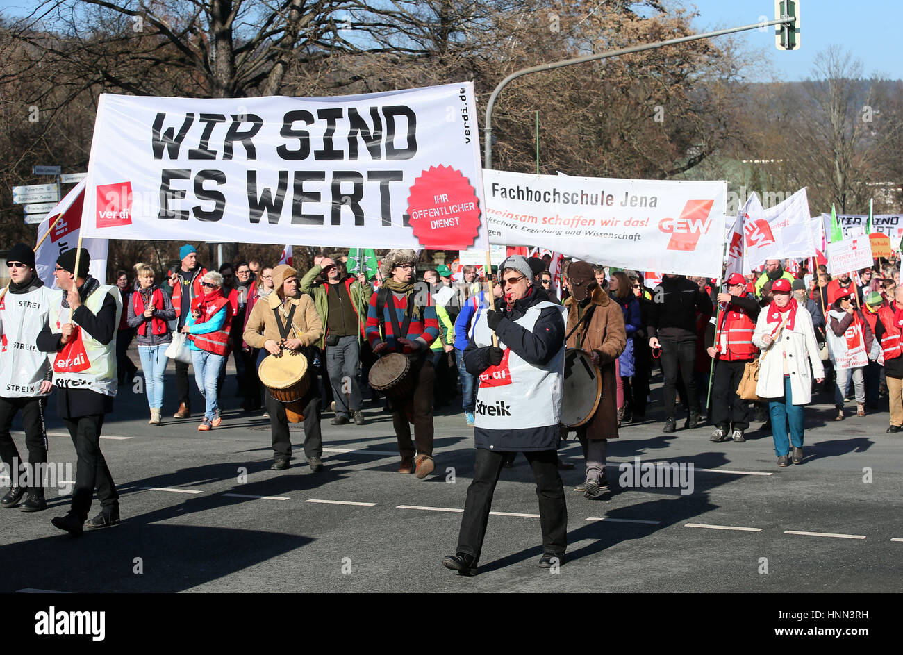 Public service employees demonstrate for higher wages with a banner the ...
