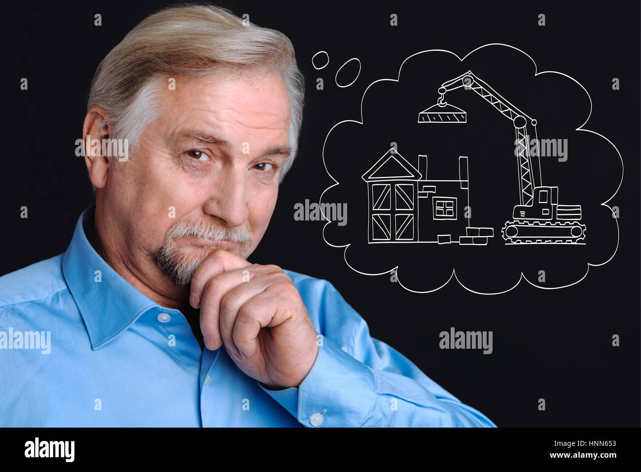 Intelligent positive man thinking about a new project Stock Photo - Alamy