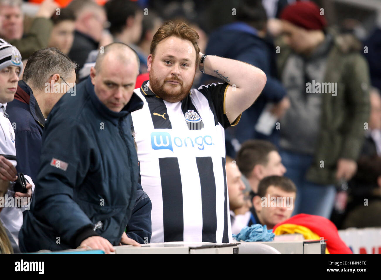 Newcastle United fans in the stands Stock Photo - Alamy