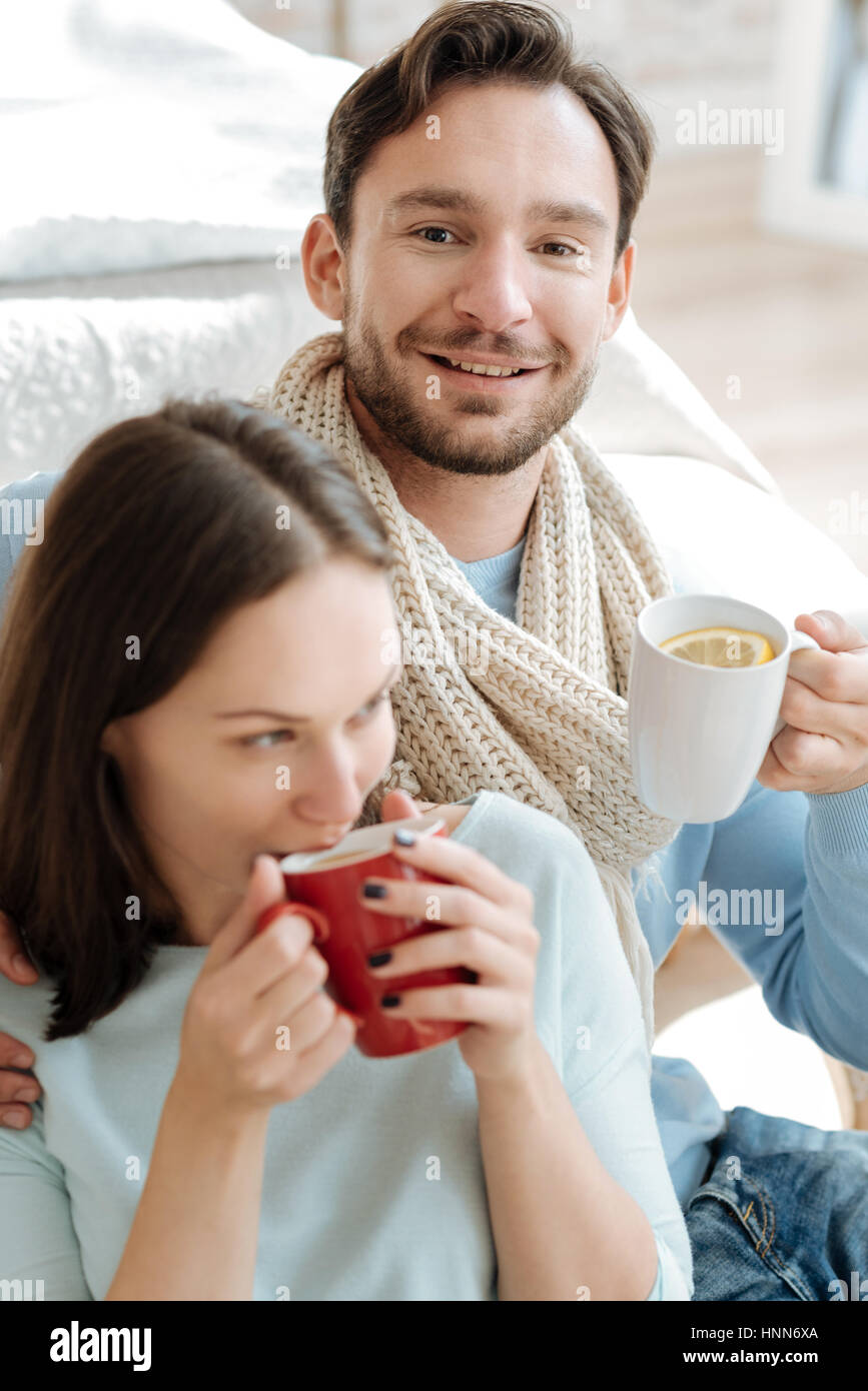 Delighted young couple resting at home Stock Photo - Alamy