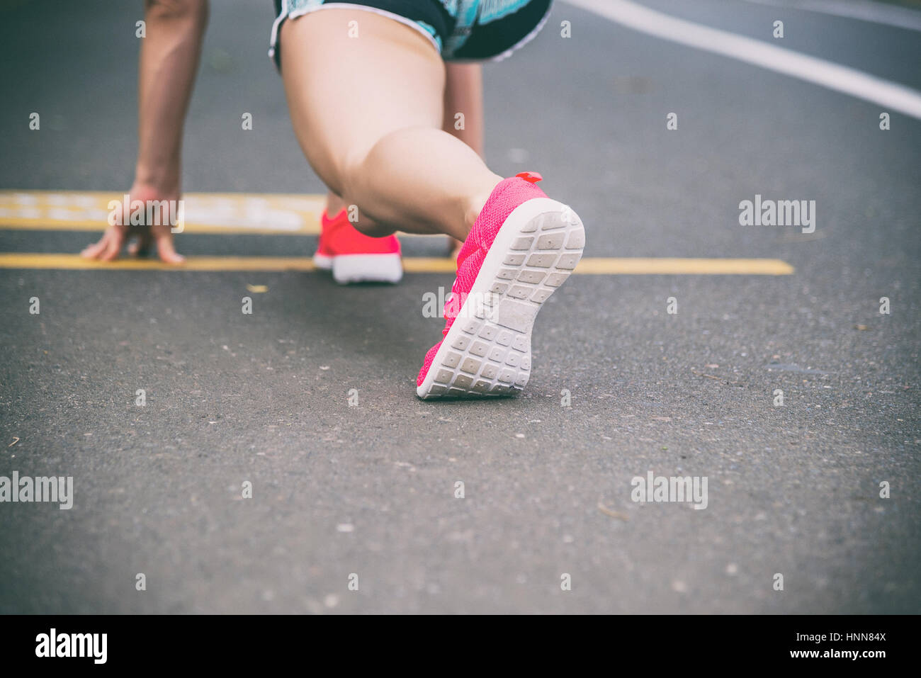 feet running on road closeup on shoe Stock Photo - Alamy