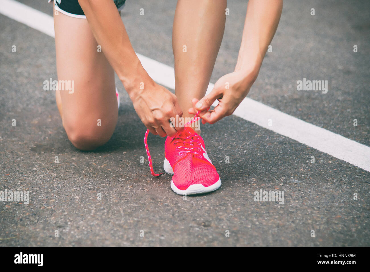 feet running on road closeup on shoe Stock Photo - Alamy