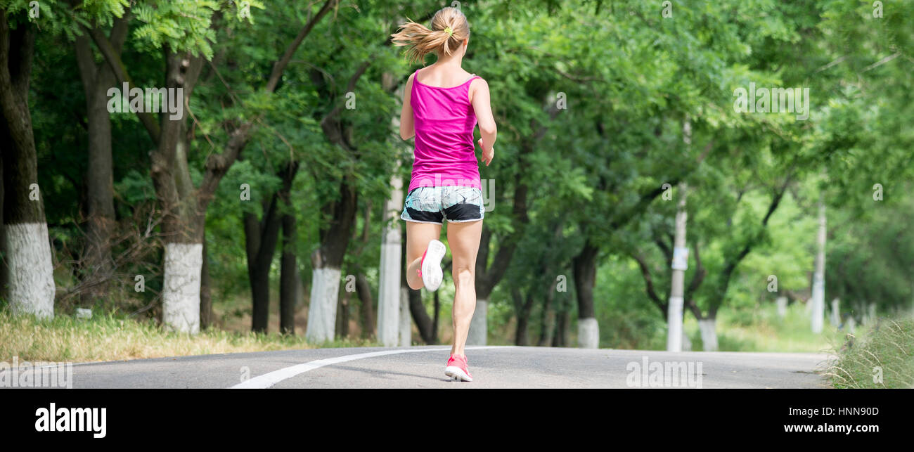 Young woman running Stock Photo - Alamy