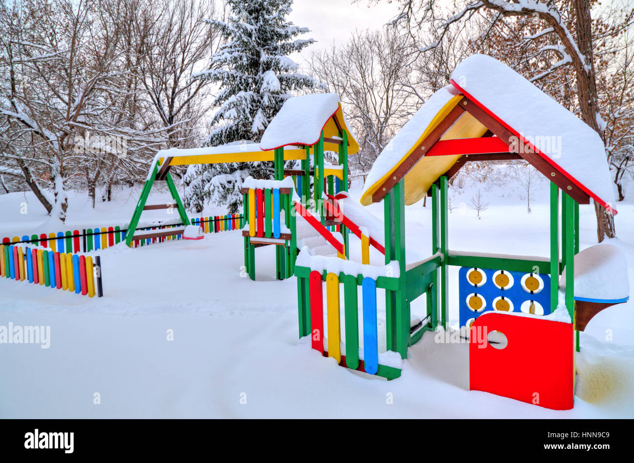 Children's playground covered with snow in winter Stock Photo - Alamy