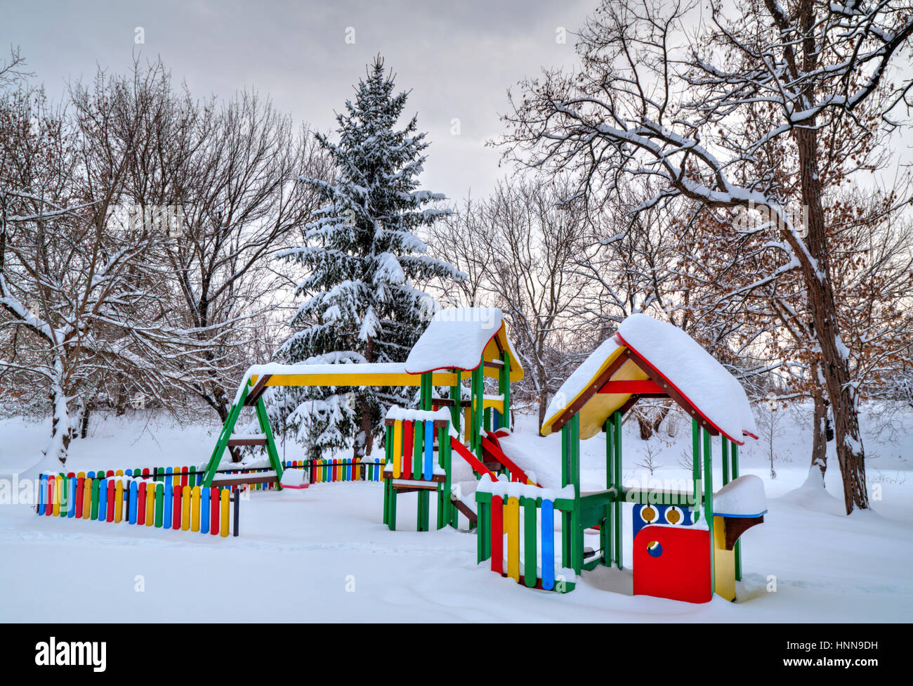 Children's playground covered with snow in winter Stock Photo - Alamy
